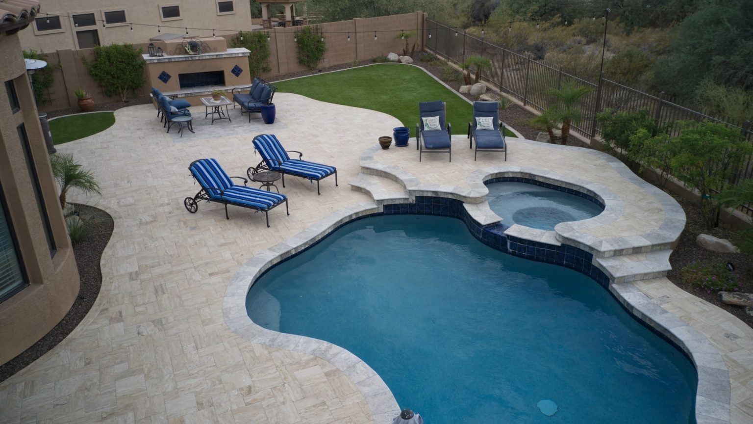How to Add a Waterfall to Your Pool: Design Tips, Costs & Styles